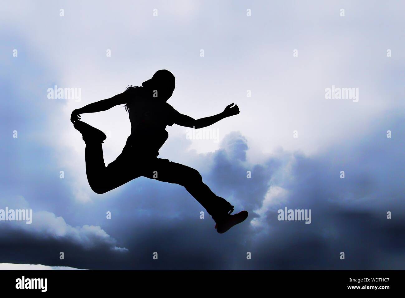 Woman Leaping High Resolution Stock Photography and Images - Alamy