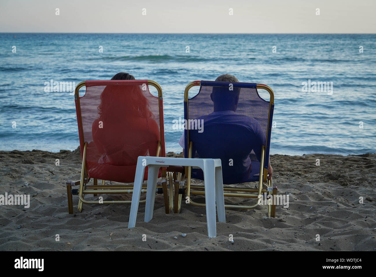 Two people in beach chairs hi-res stock photography and images - Alamy