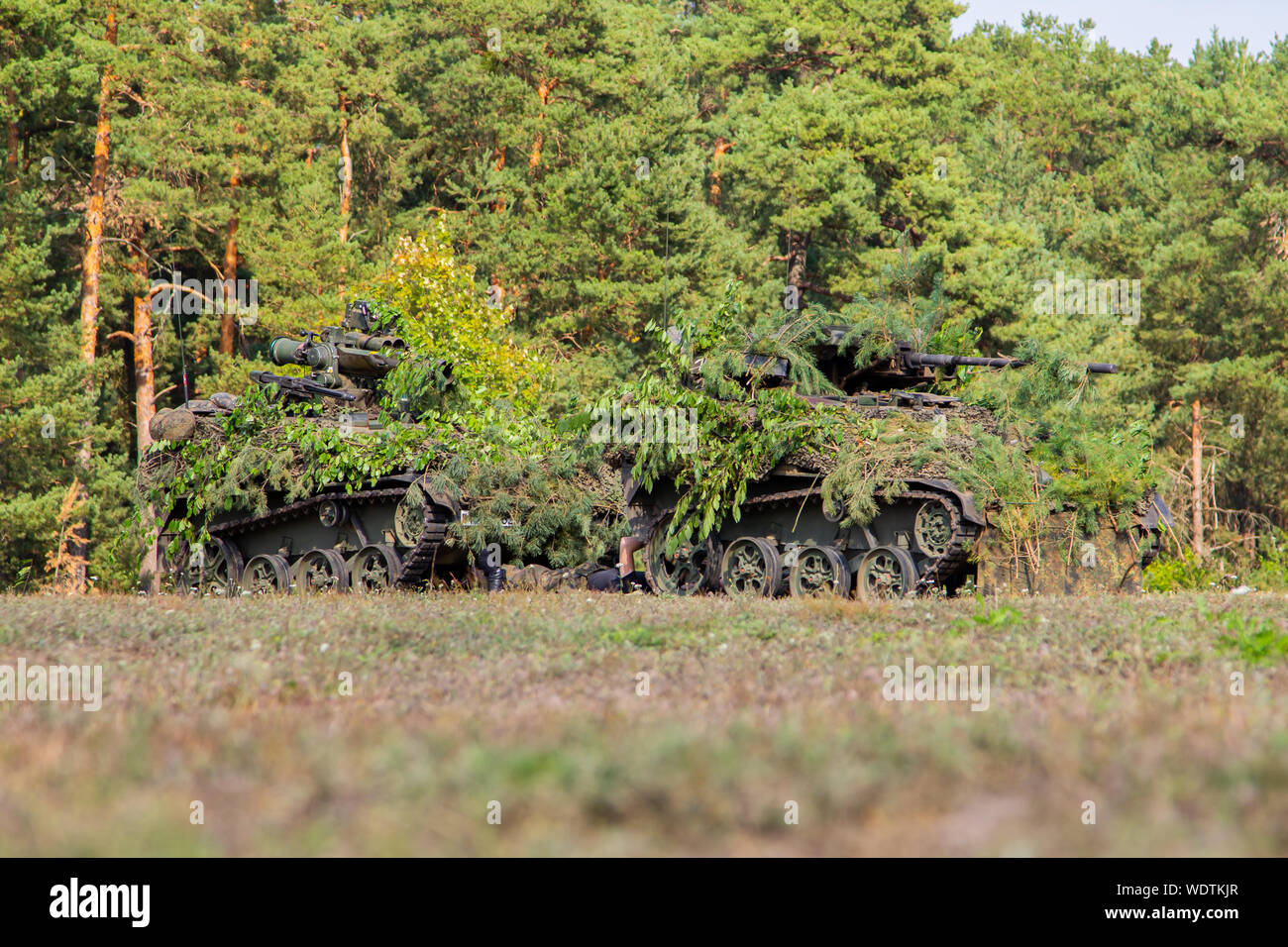 Armoured weapons carrier from german army stands at military training ...