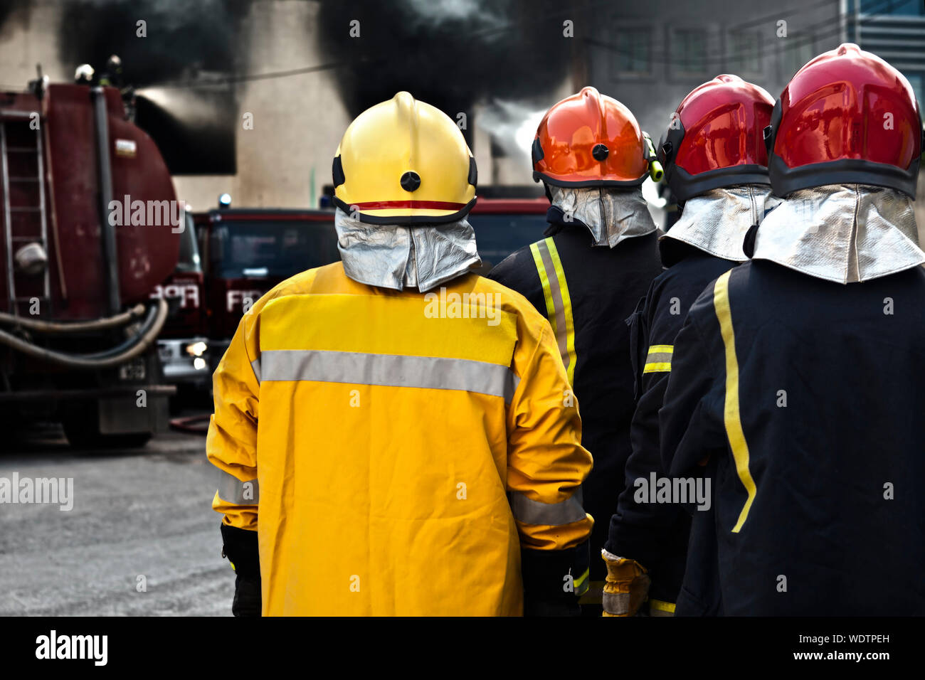 Firefighters standing on street hi-res stock photography and images - Alamy