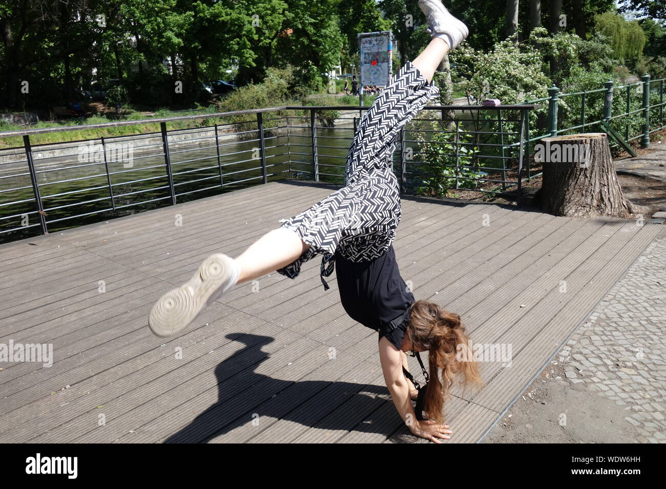 Woman cartwheel hi-res stock photography and images - Alamy