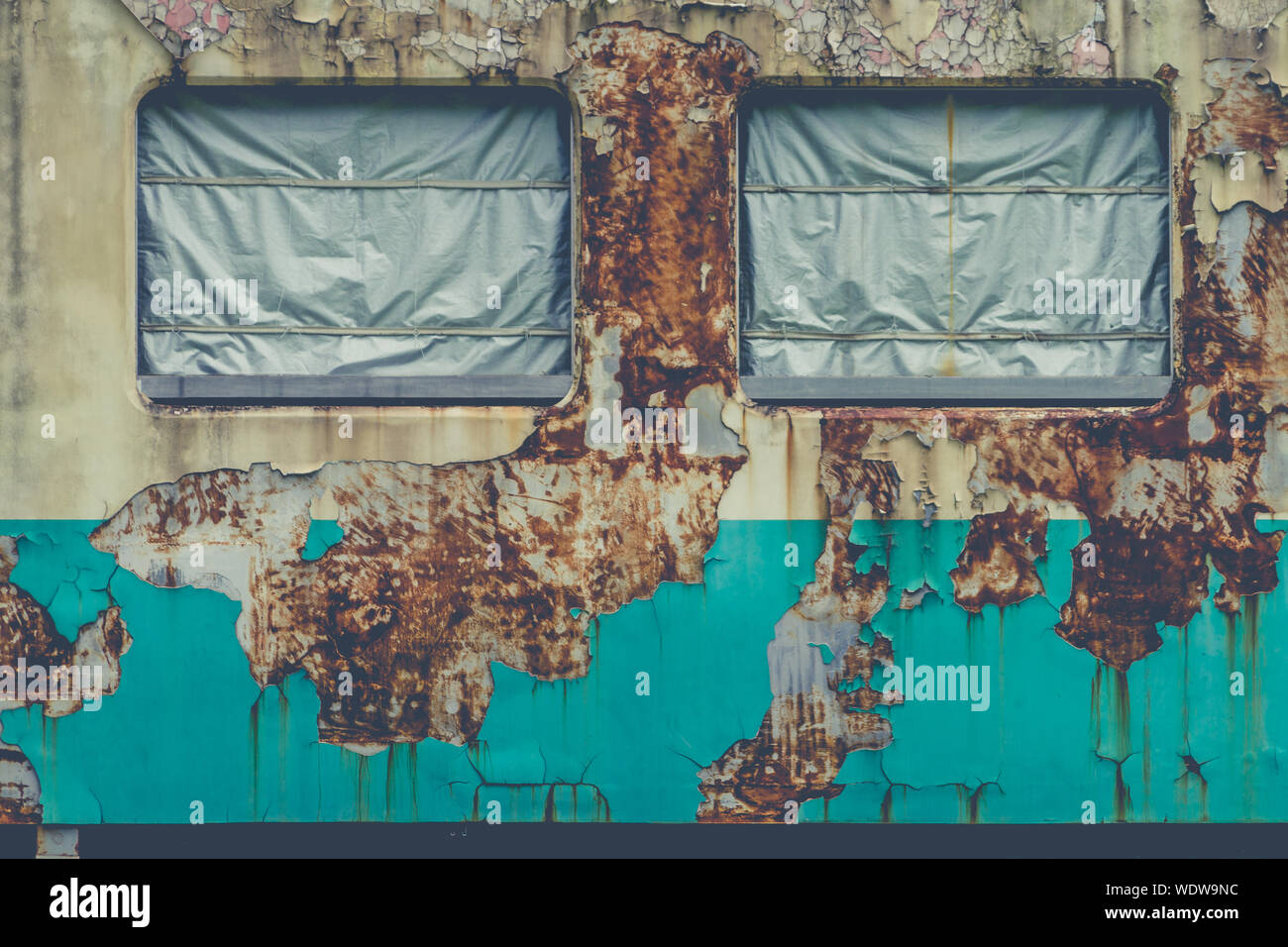 Windows Of Weathered Train Covered With Tarpaulin Stock Photo - Alamy