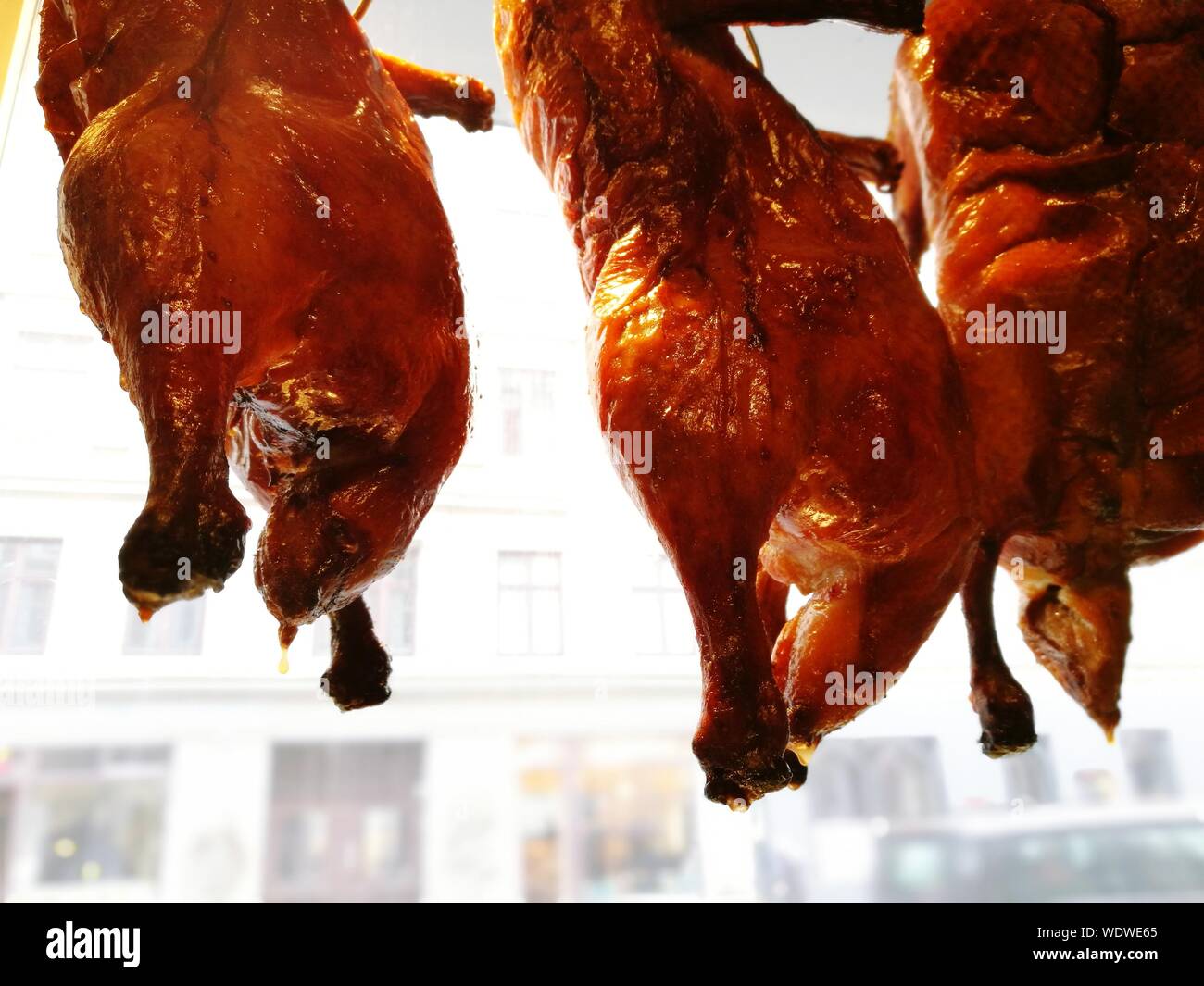 Hanging roast chicken hi-res stock photography and images - Alamy