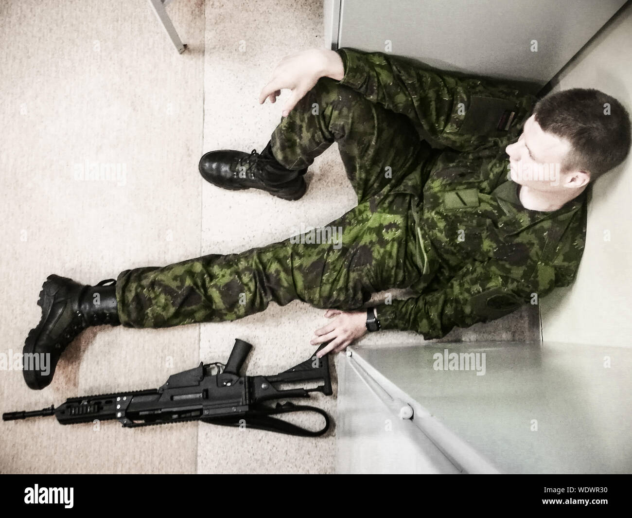 Military sitting gun hi-res stock photography and images - Alamy