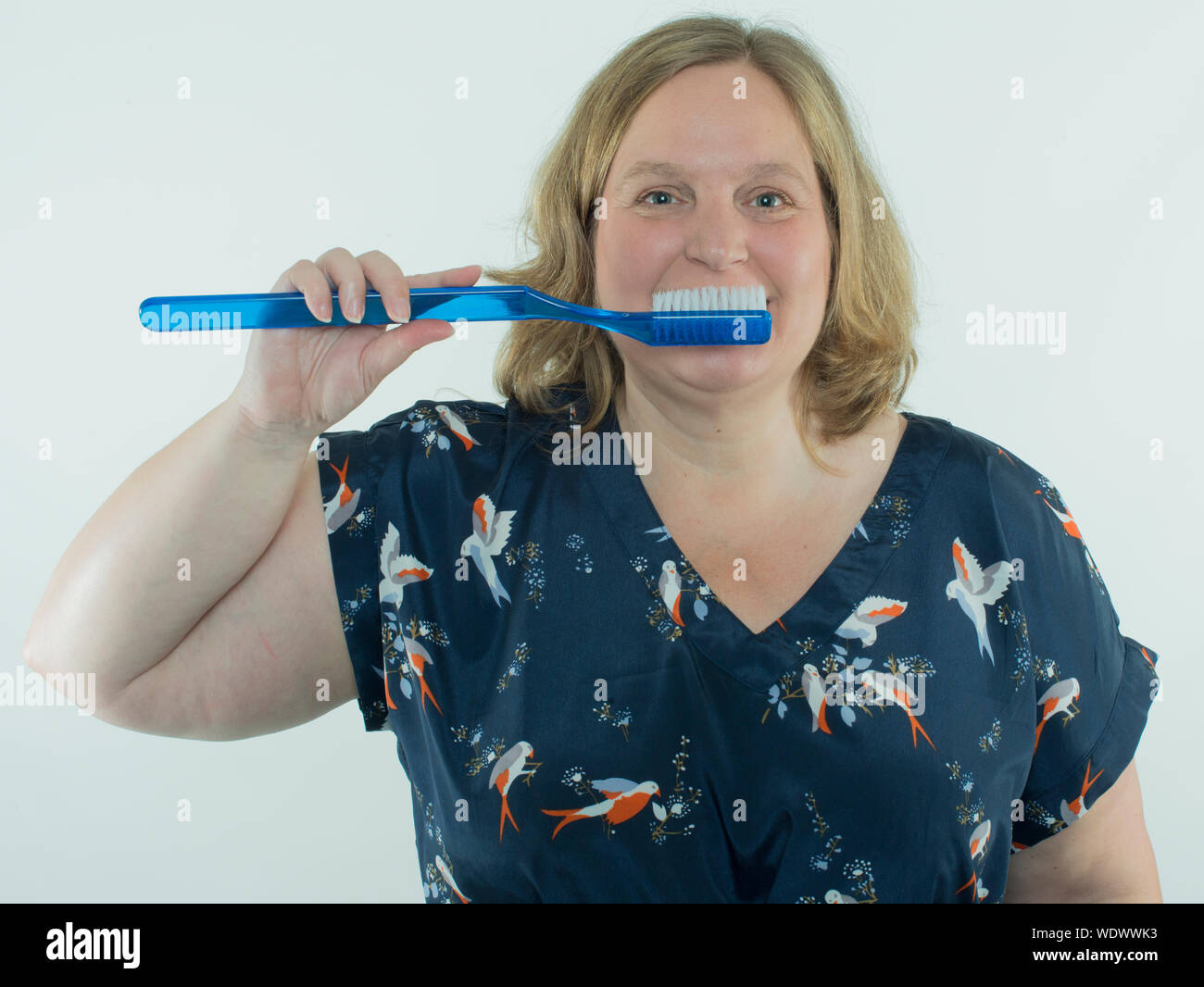 Mature woman brushing hair hi-res stock photography and images - Alamy