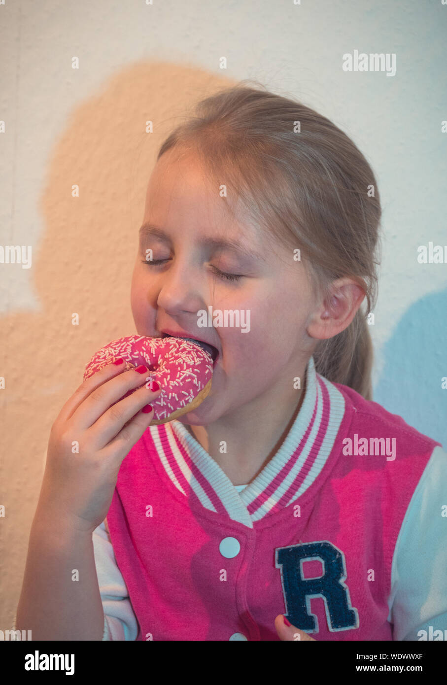Donut eating hi-res stock photography and images - Alamy