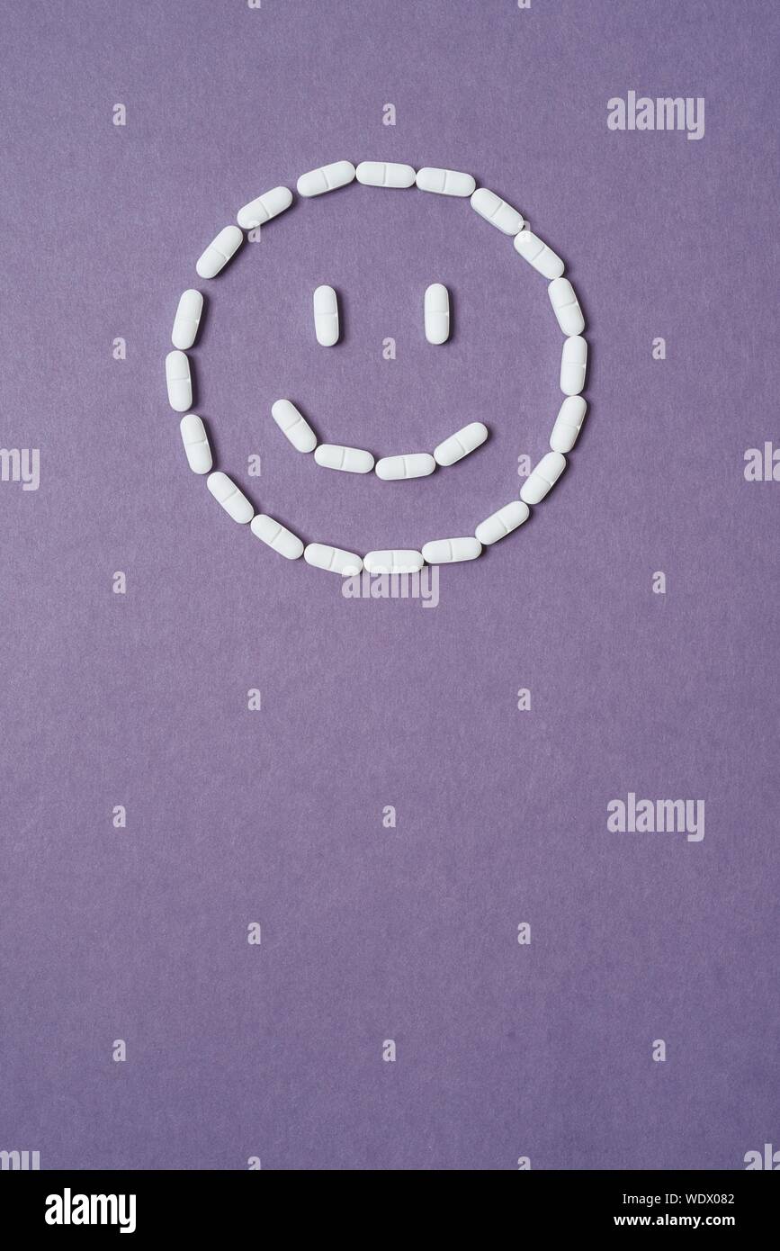Smiley face pill hi-res stock photography and images - Alamy