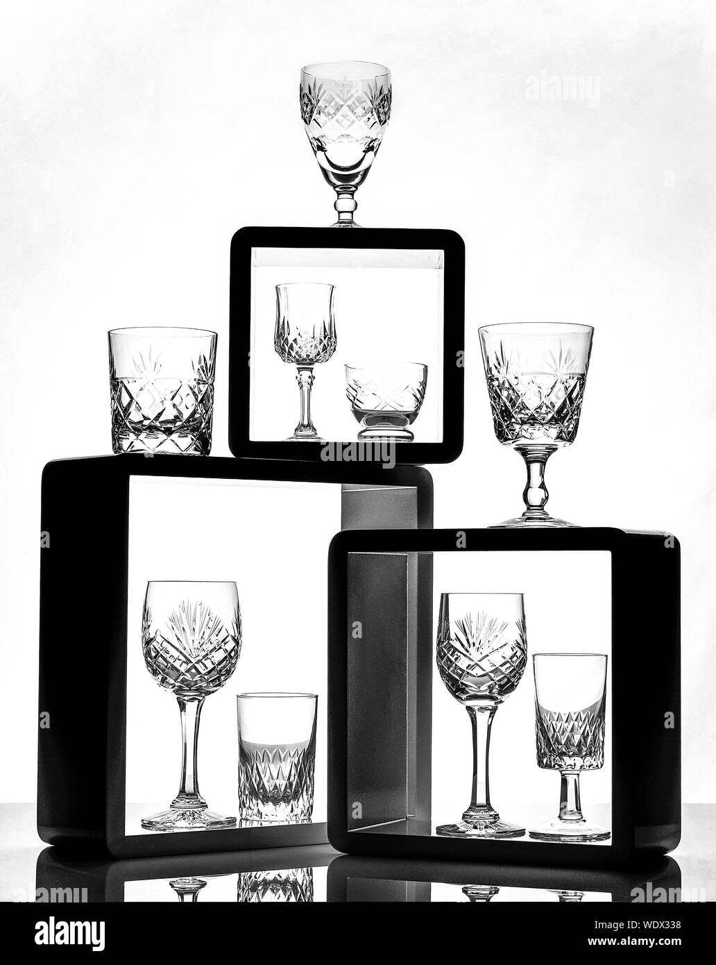 Close-up Of Glassware On Shelves Against White Background Stock Photo ...