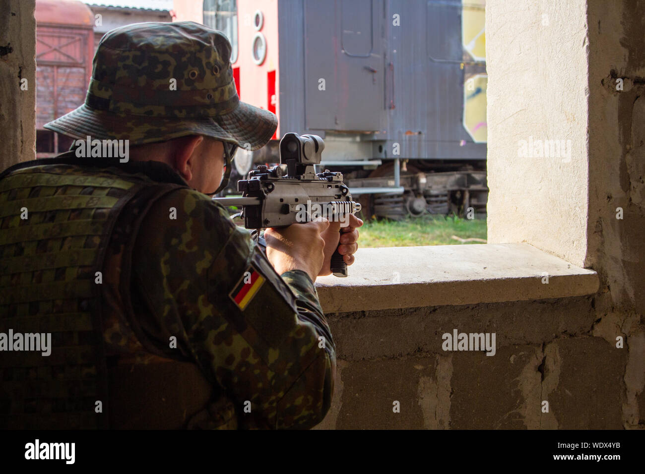 German soldier with a gun at military training area Stock Photo - Alamy