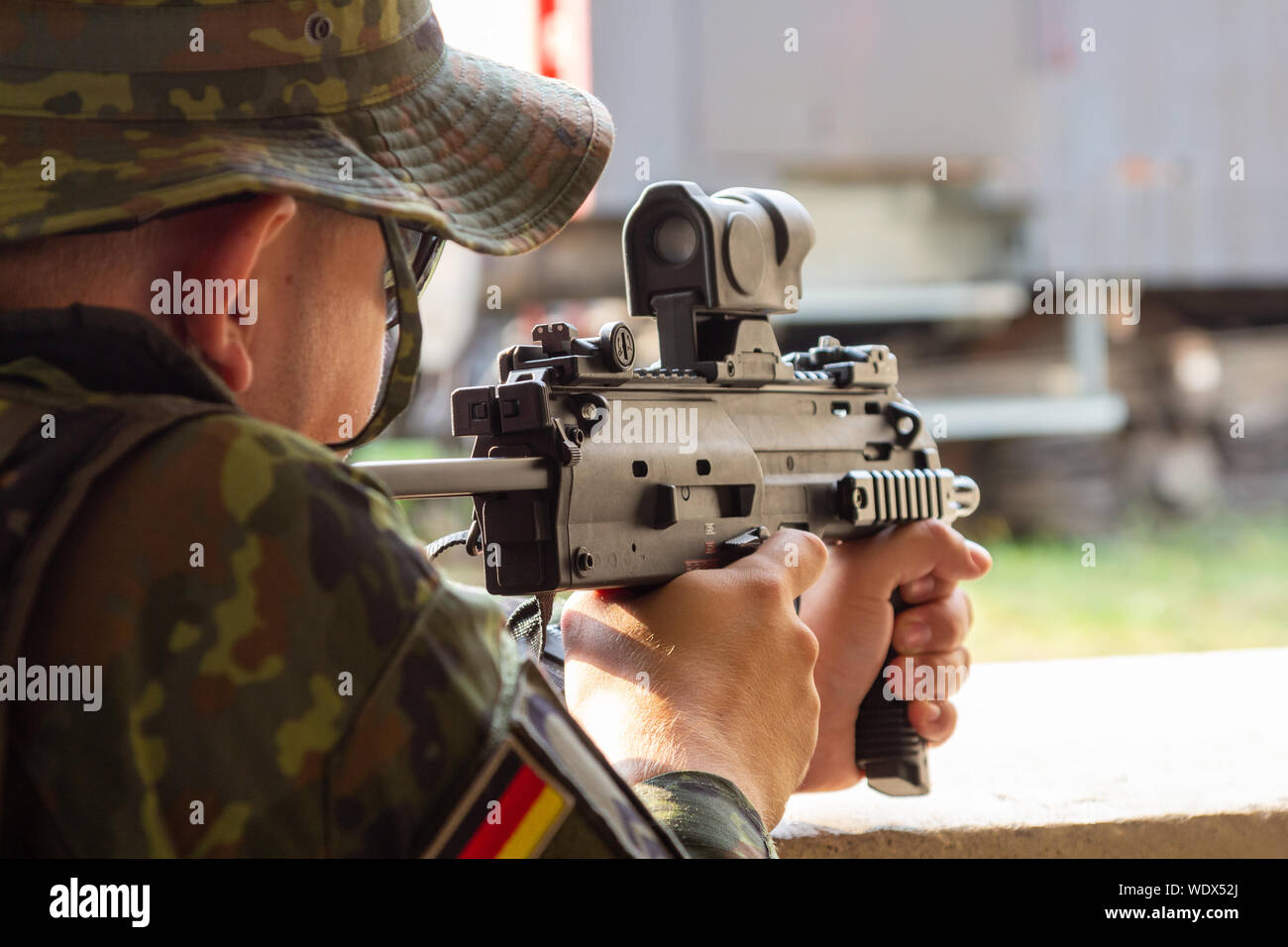 German soldier with a gun at military training area Stock Photo - Alamy