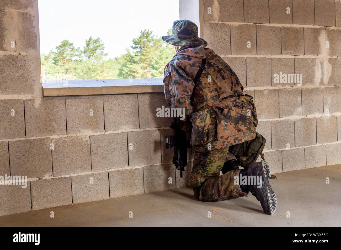 German soldier with a gun at military training area Stock Photo - Alamy