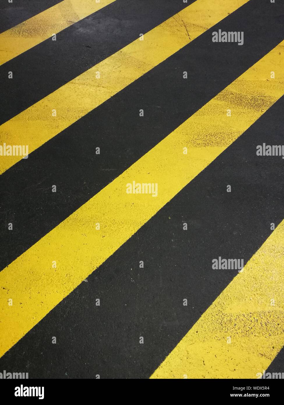 Yellow black striped road sign hi-res stock photography and images - Alamy