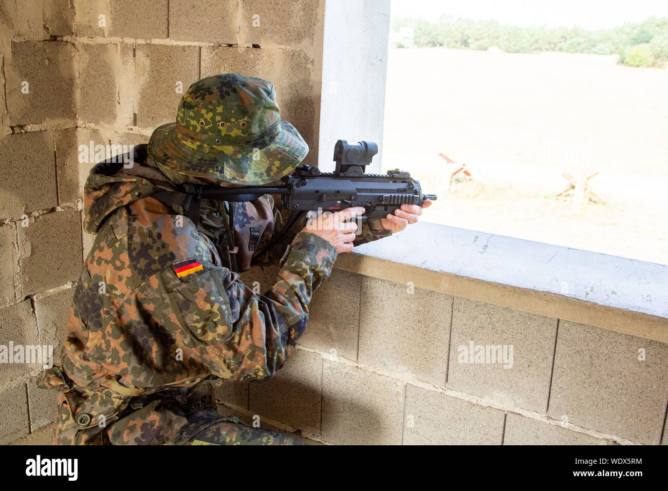 German soldier with a gun at military training area Stock Photo - Alamy