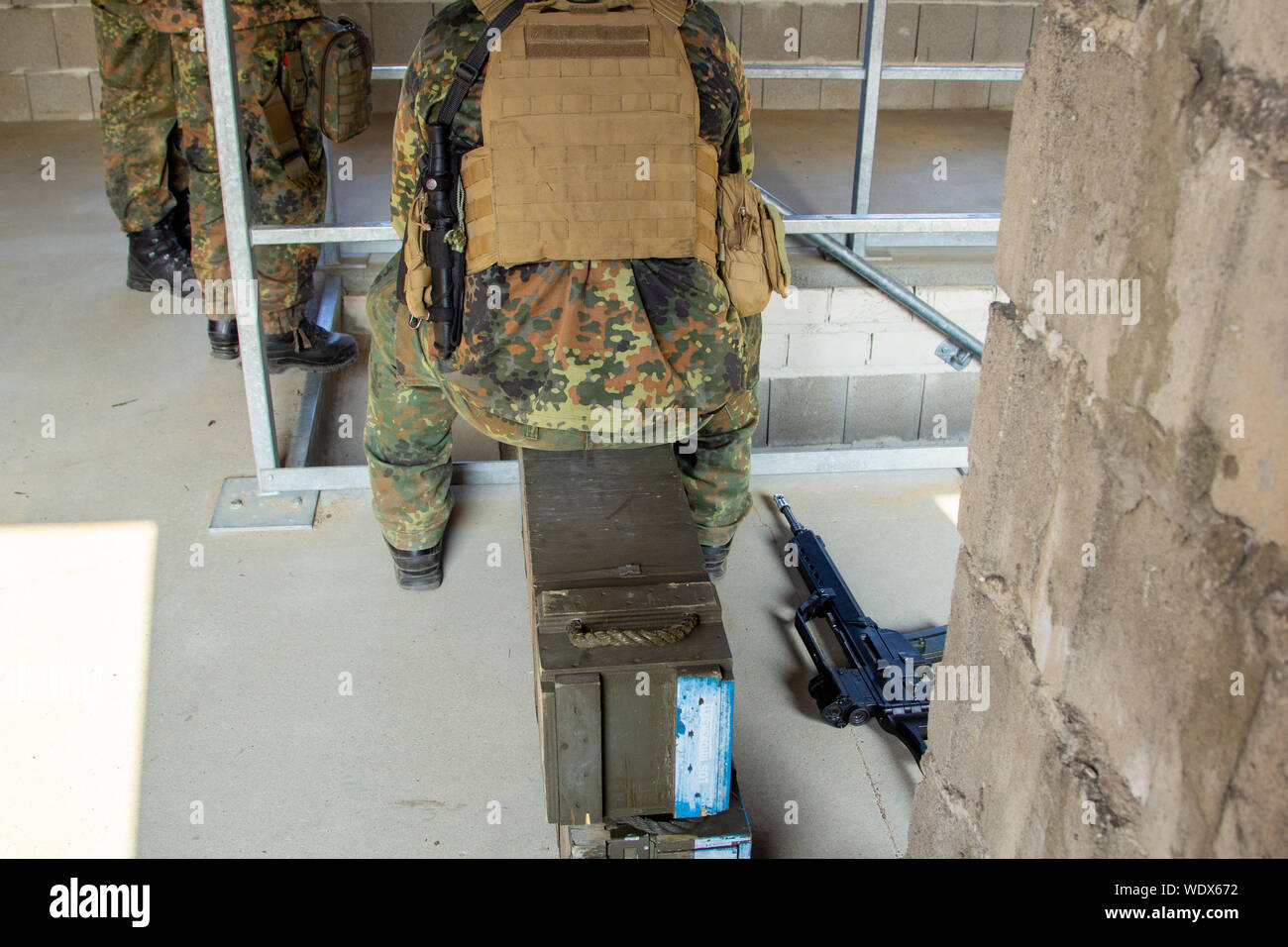 German soldier with a gun at military training area Stock Photo - Alamy