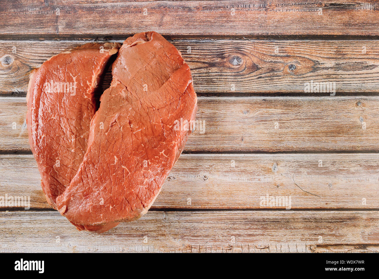 Raw beef steak texture close up over the wooden background Stock Photo ...