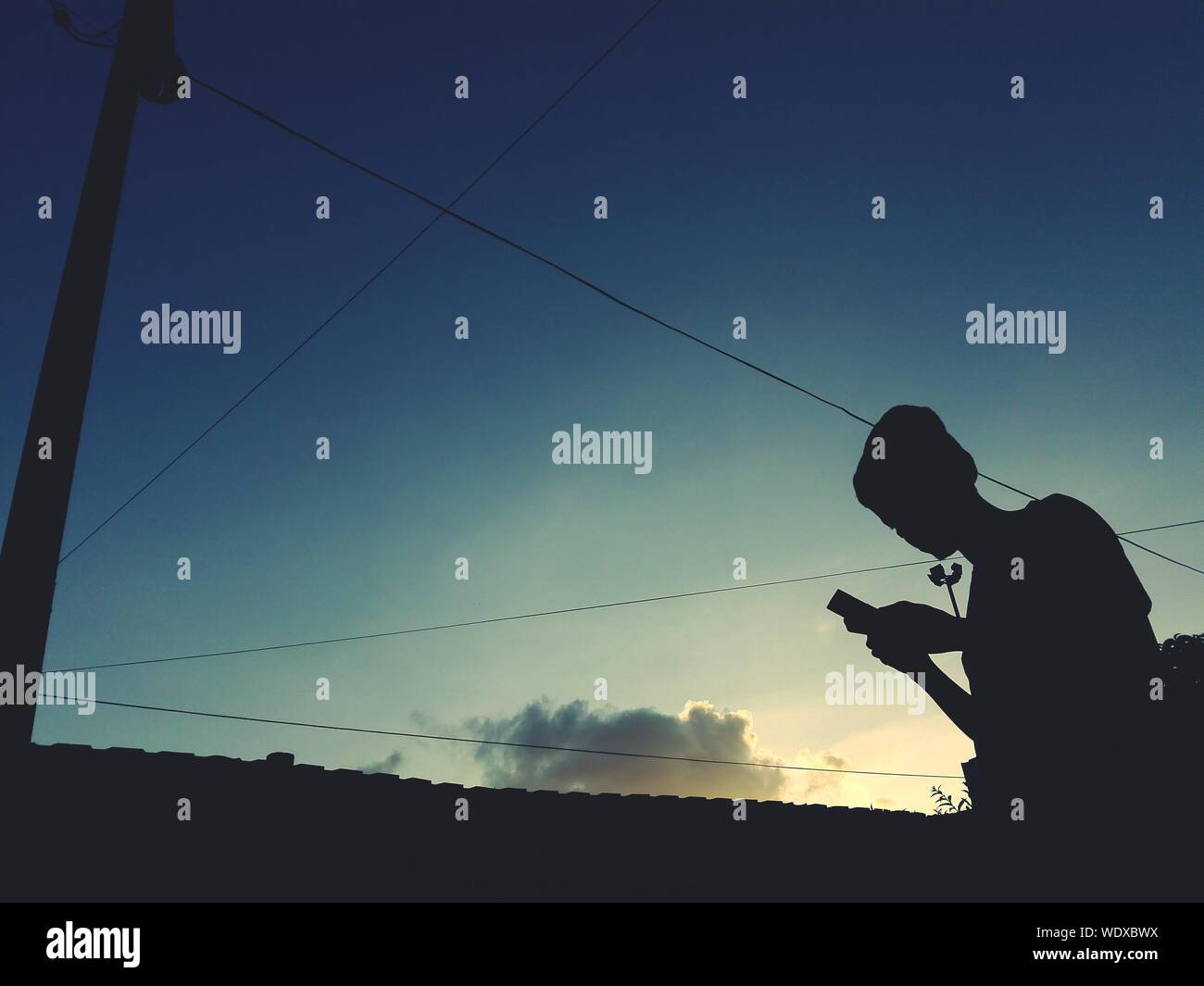 Silhouette of person using mobile phone hi-res stock photography and ...