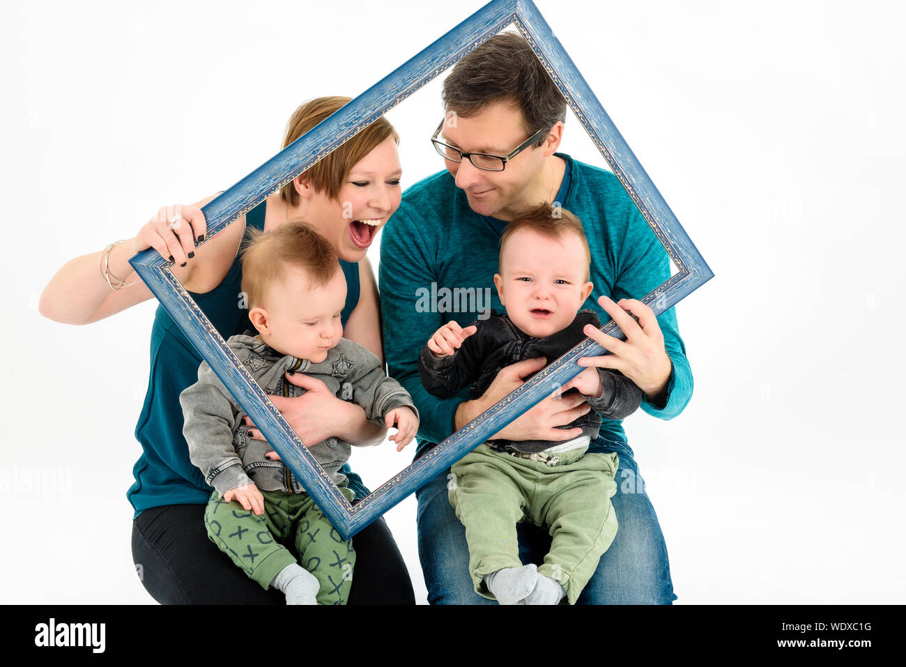 Family holding frame hi-res stock photography and images - Alamy