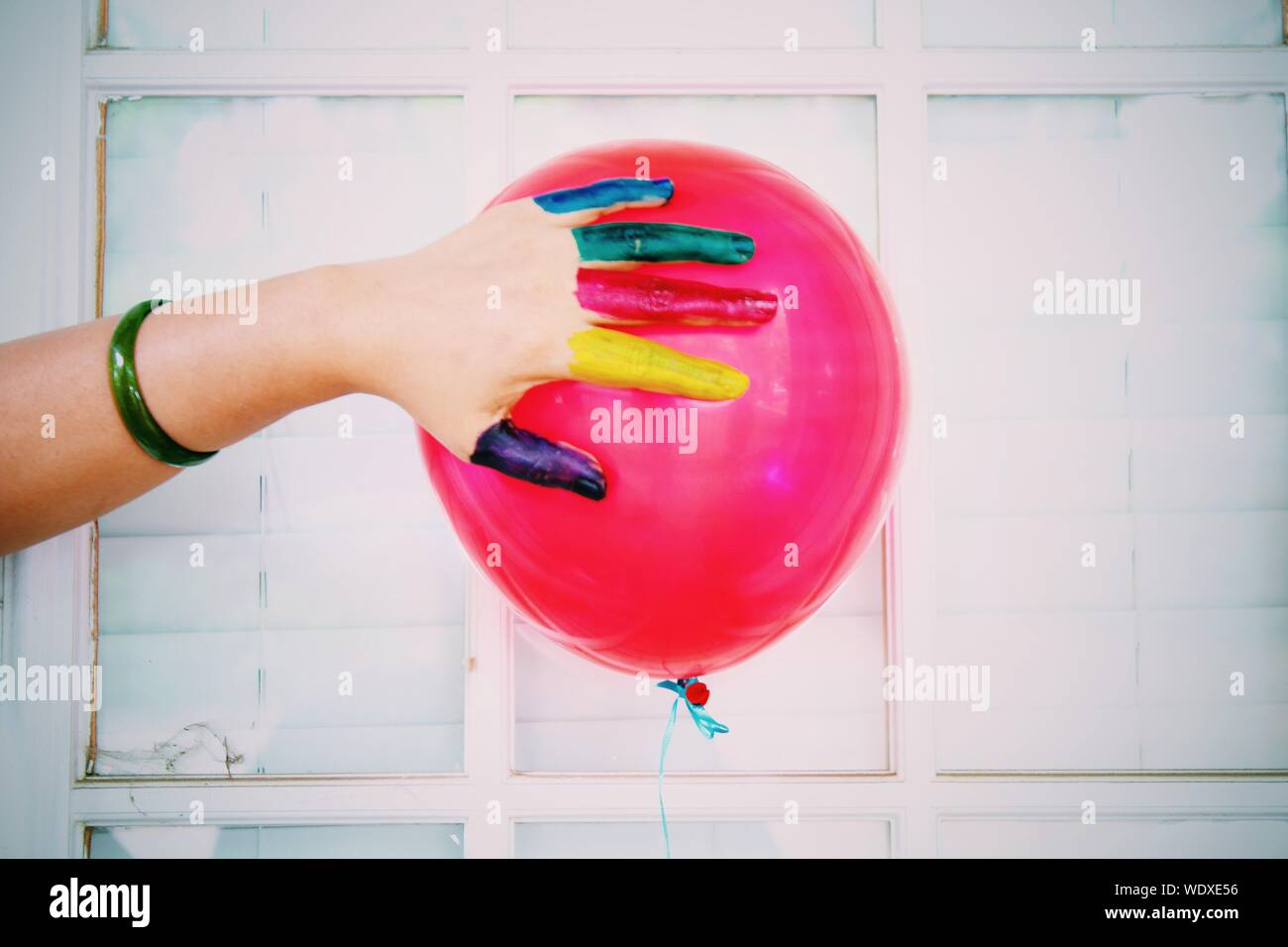 Finger and balloon hi-res stock photography and images - Alamy