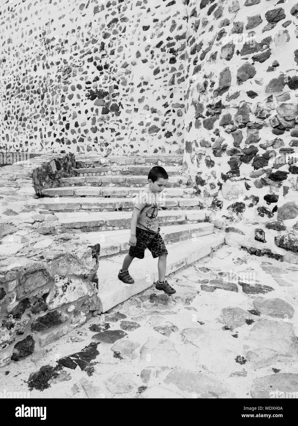 Full length boy side view Black and White Stock Photos & Images - Alamy