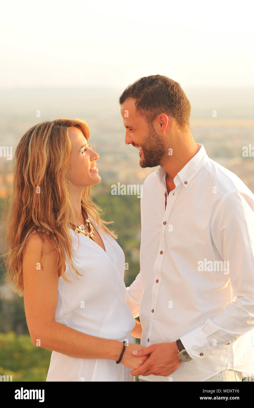 Romantic couple holding hands hi-res stock photography and images - Alamy