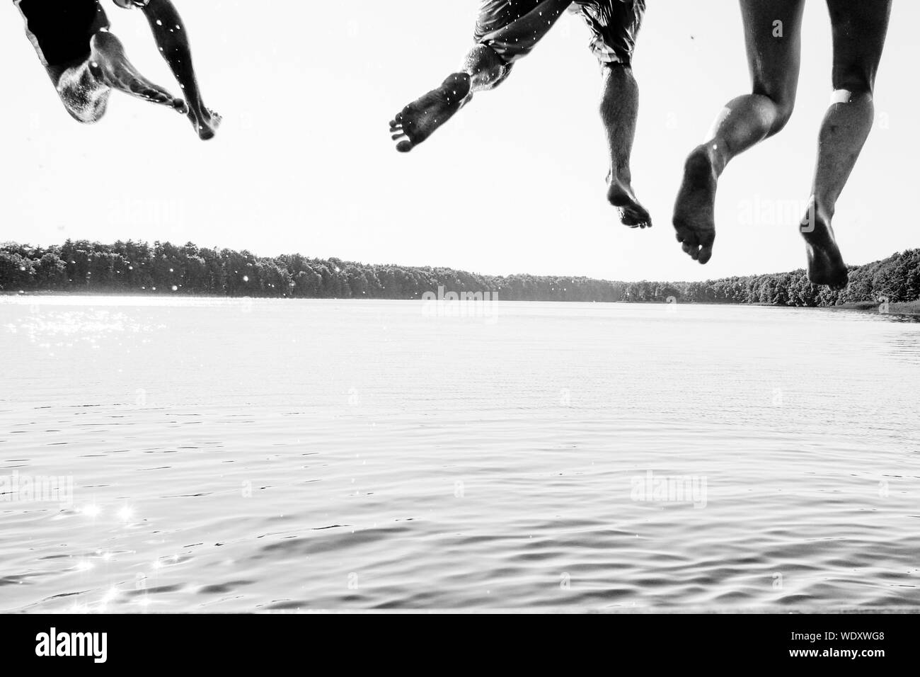 Friends Jumping Into River Stock Photos & Friends Jumping Into River ...