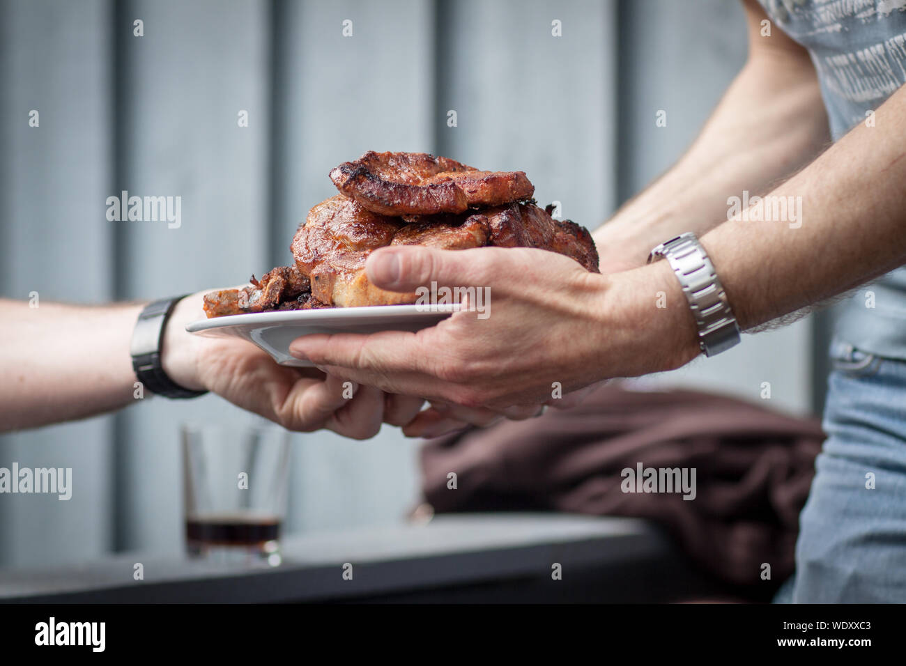 Man giving food hi-res stock photography and images - Alamy