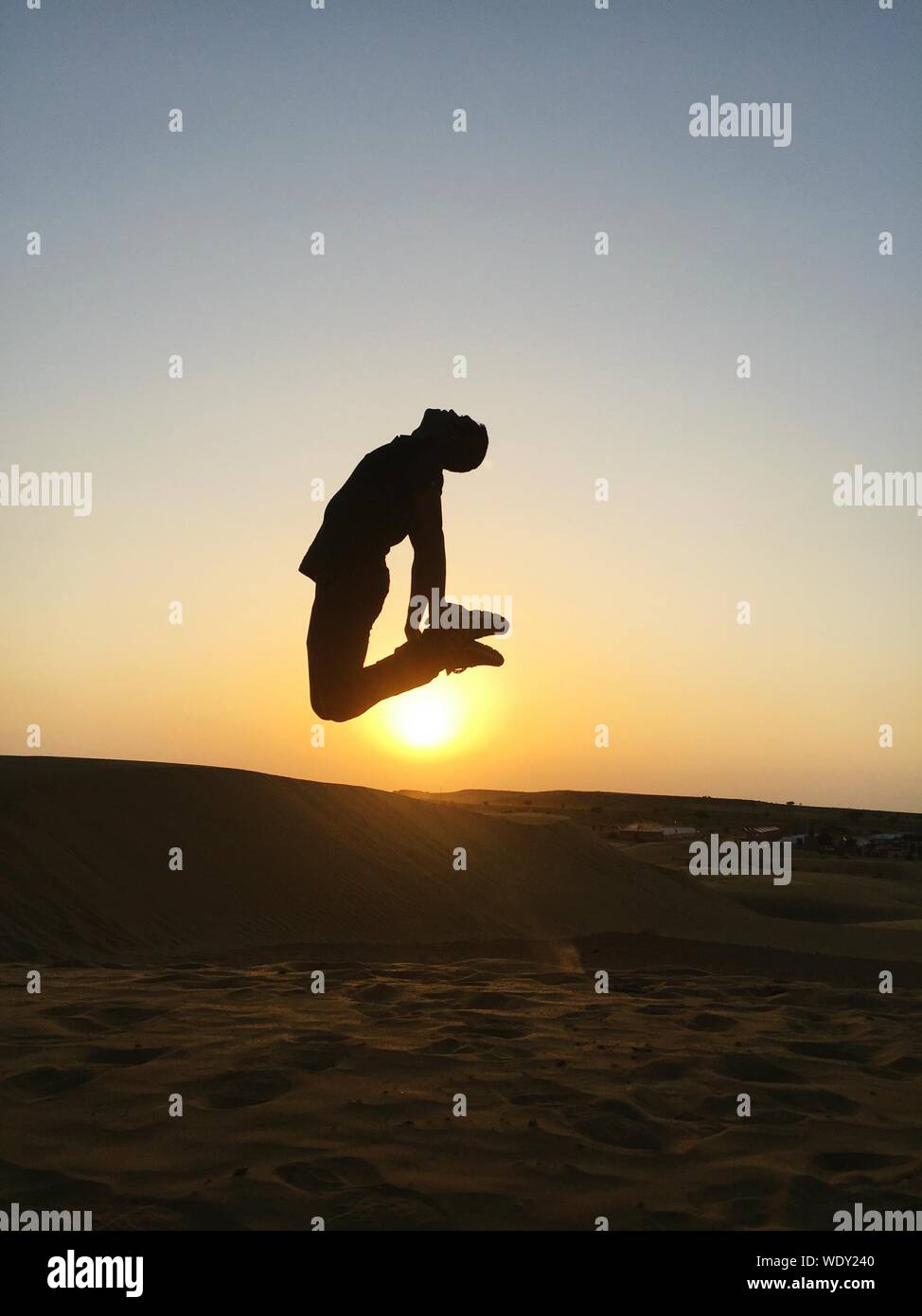 Man jumping in mid air sun hi-res stock photography and images - Alamy