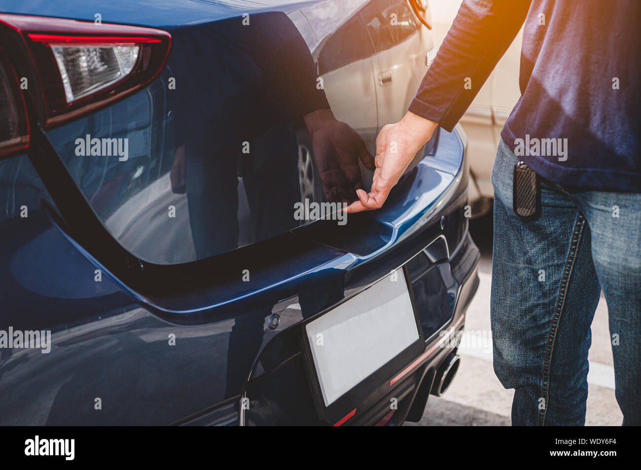 Open car trunk hand hi-res stock photography and images - Alamy