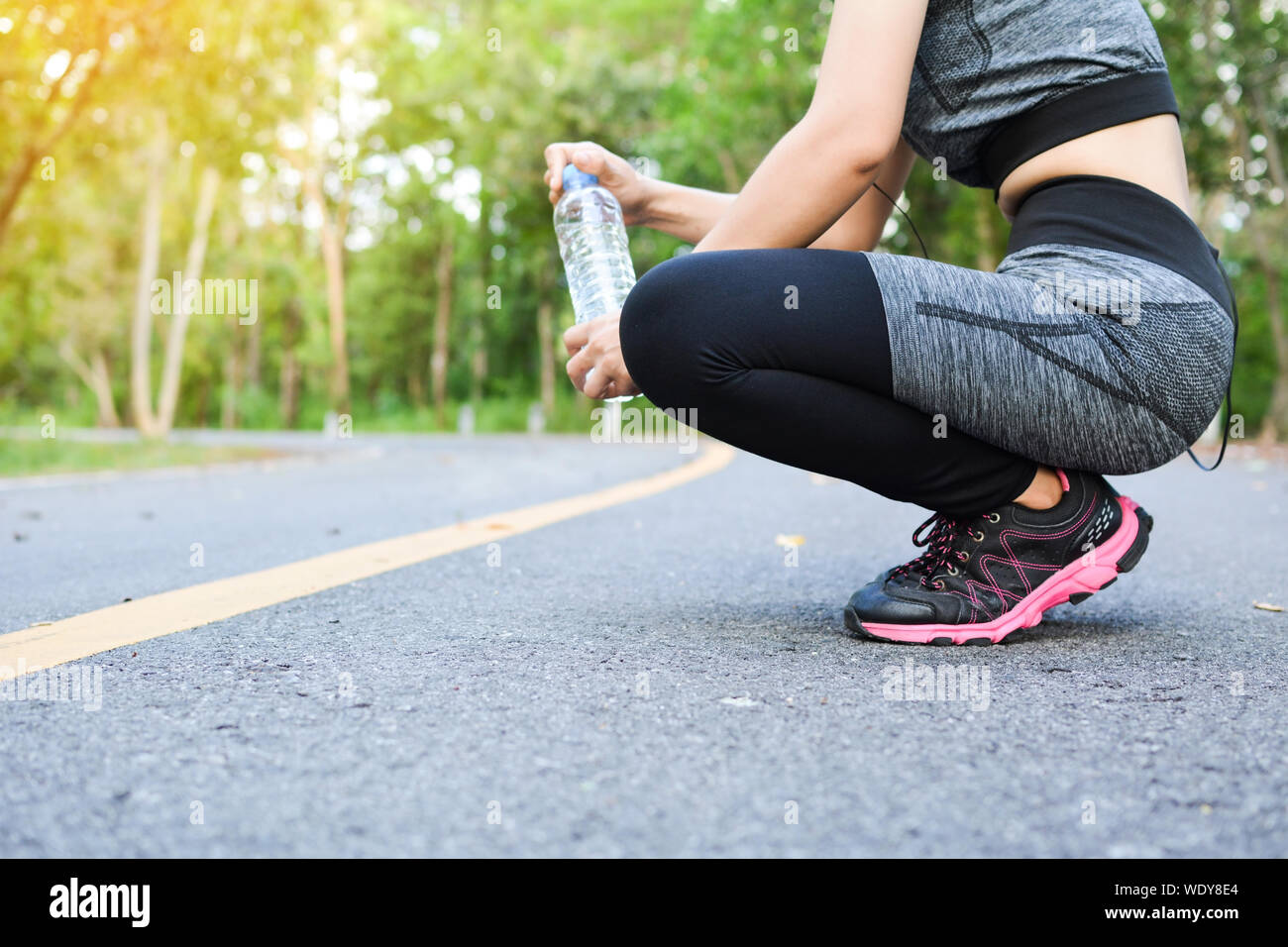 Women squatting hi-res stock photography and images - Alamy
