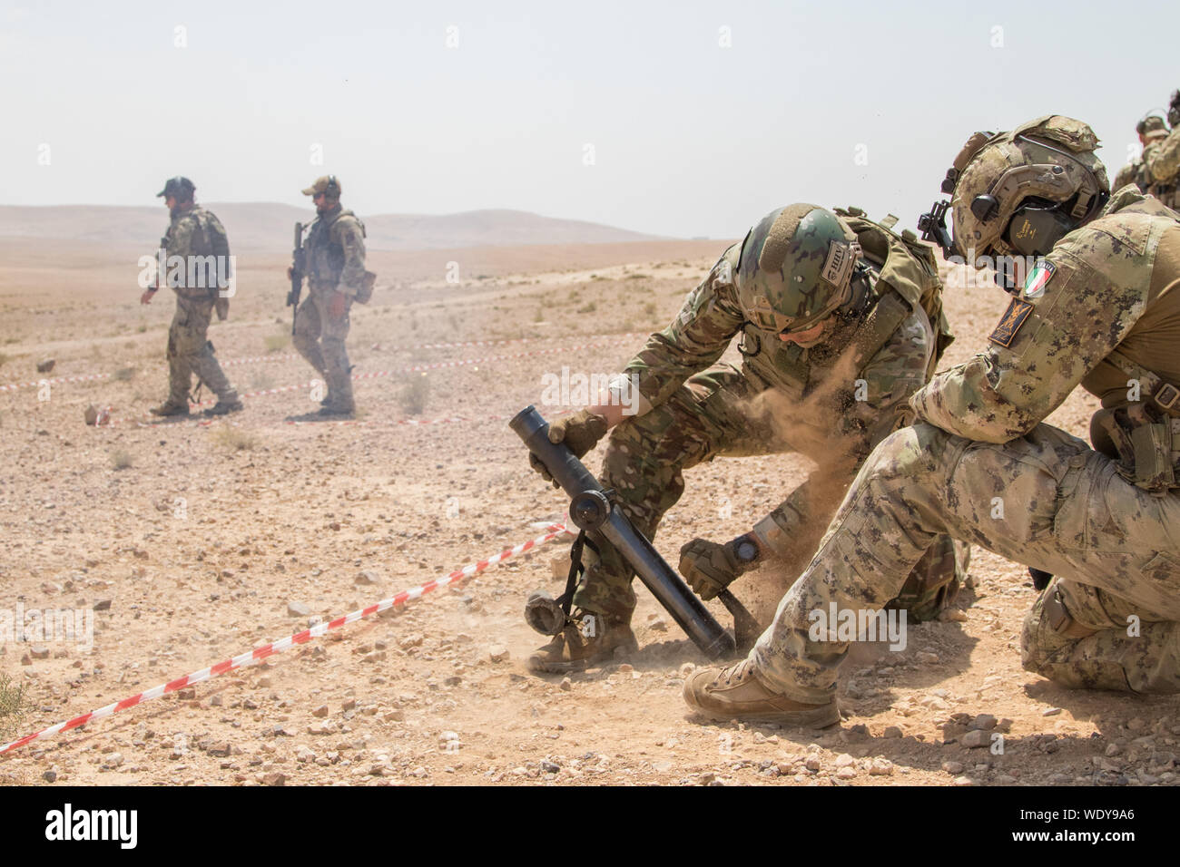 A member of the U.S. Army Special Operations Command fires an Italian ...