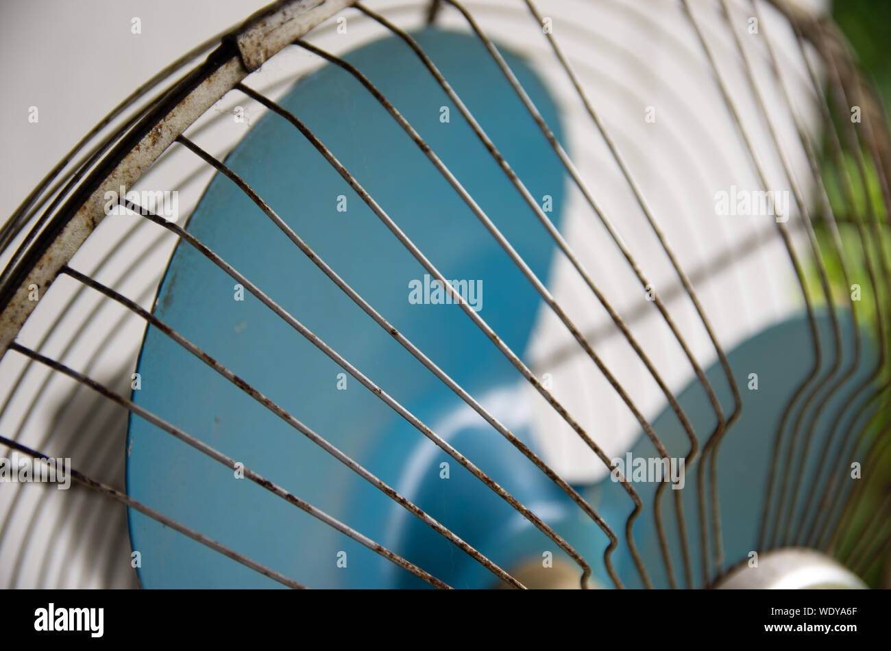 Vintage old white stand fan with blue blades Stock Photo - Alamy