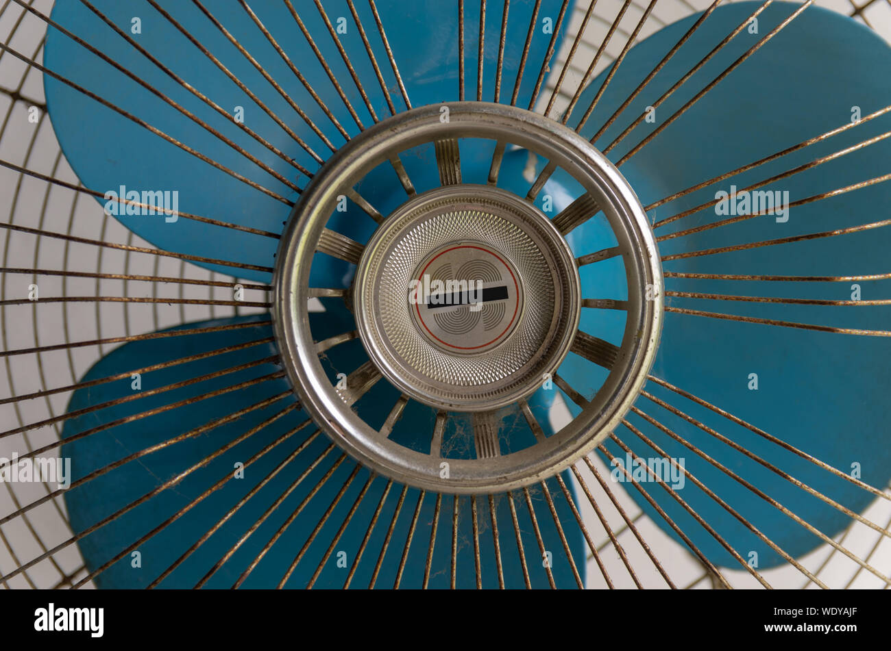 Vintage old white stand fan with blue blades Stock Photo - Alamy