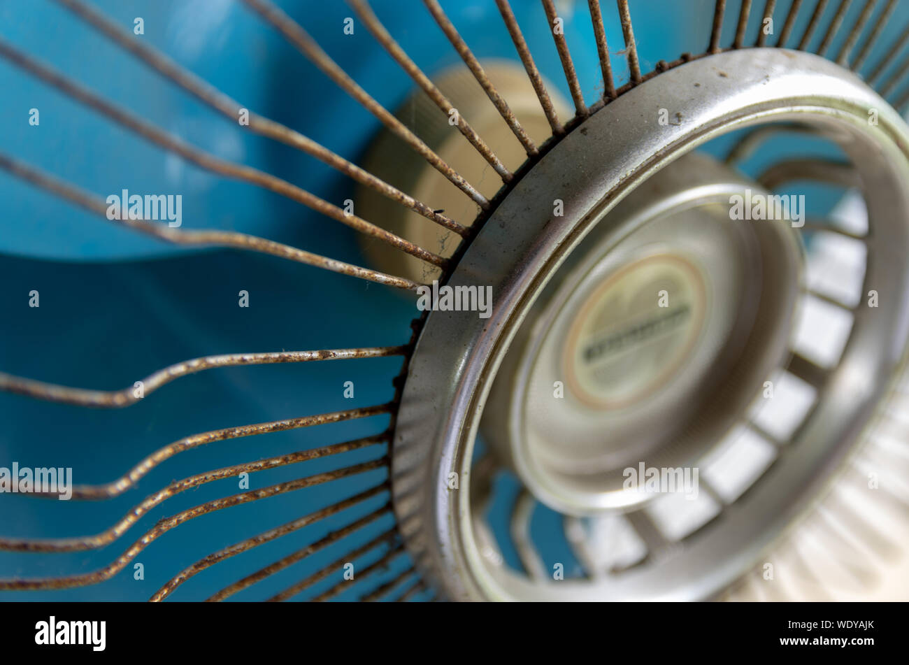 Vintage old white stand fan with blue blades Stock Photo - Alamy