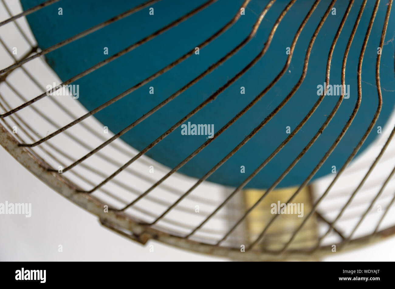 Vintage old white stand fan with blue blades Stock Photo - Alamy