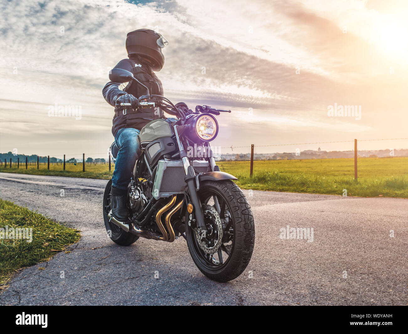 Biker riding motorcycle low angle hi-res stock photography and images ...
