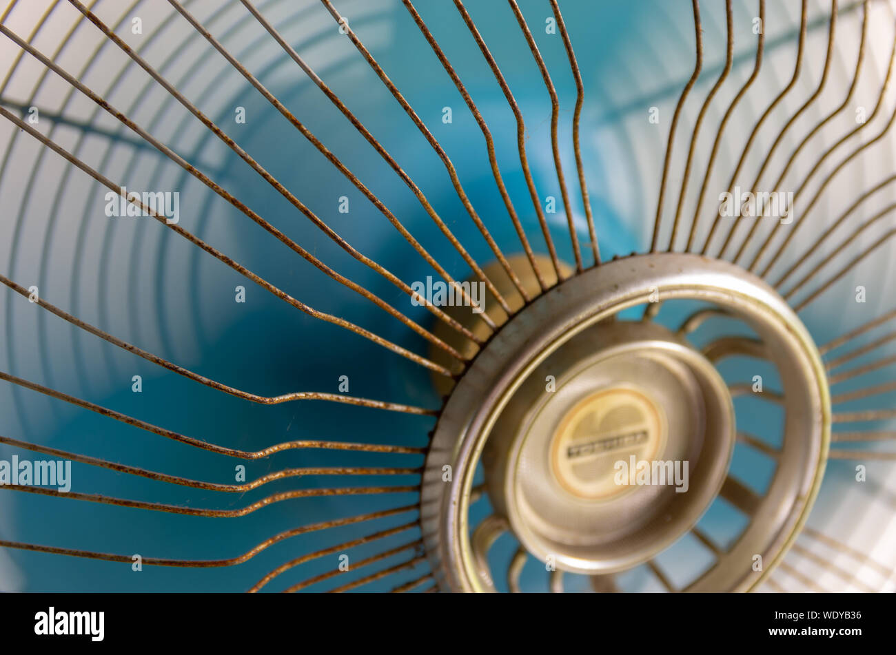 Vintage old white stand fan with blue blades Stock Photo - Alamy