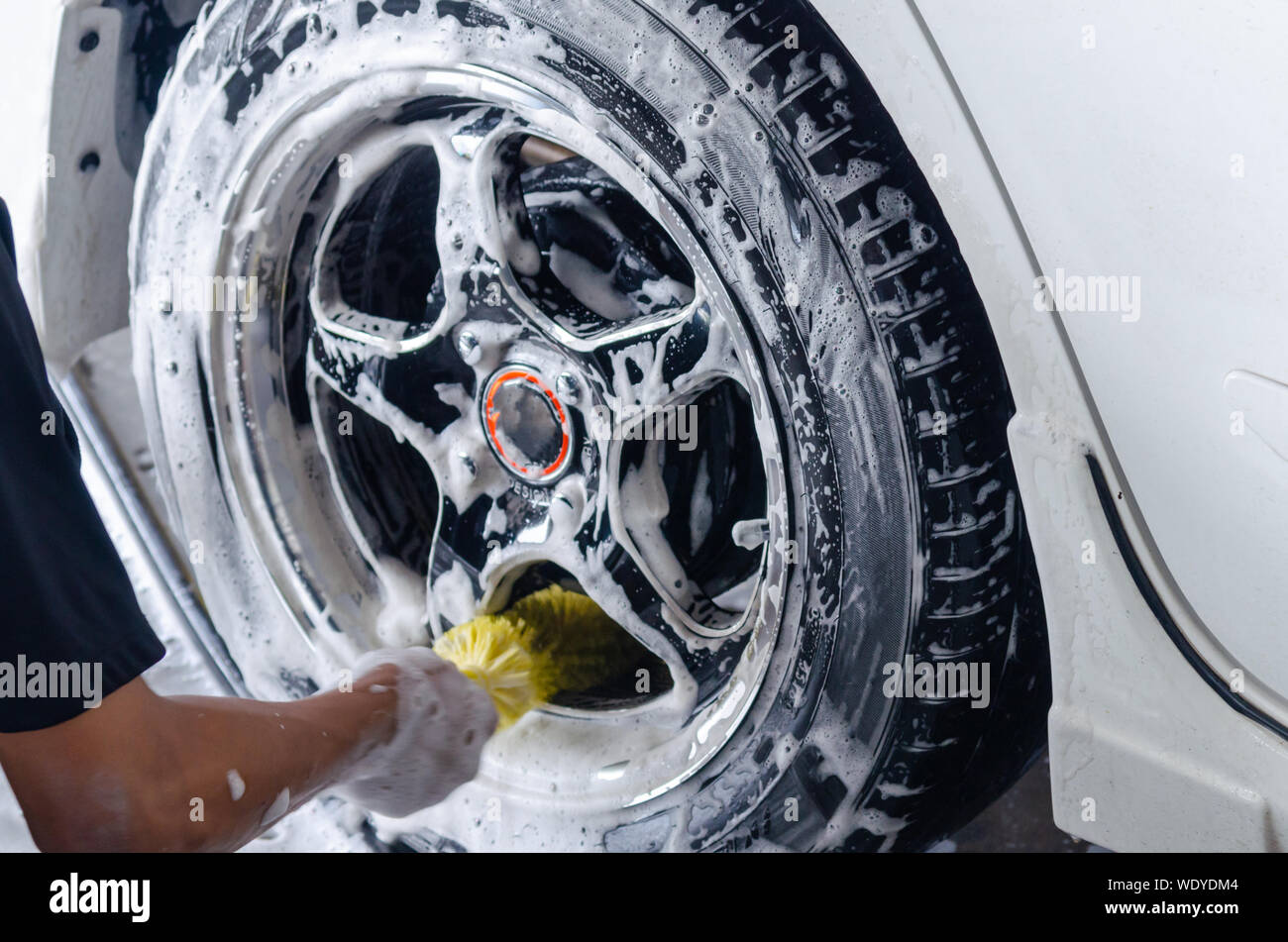 Car wash, cleaning the wheels Stock Photo - Alamy