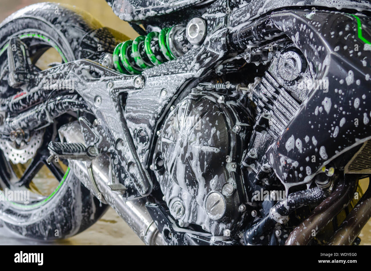 Bubble foam cleaning motorcycle wash Stock Photo - Alamy