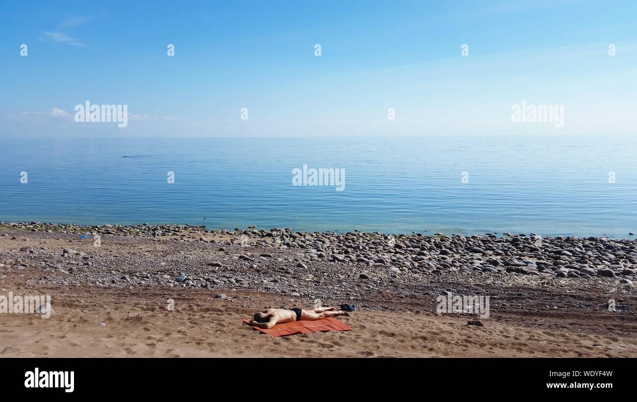 Man Sunbathing Beach High Resolution Stock Photography and Images - Alamy