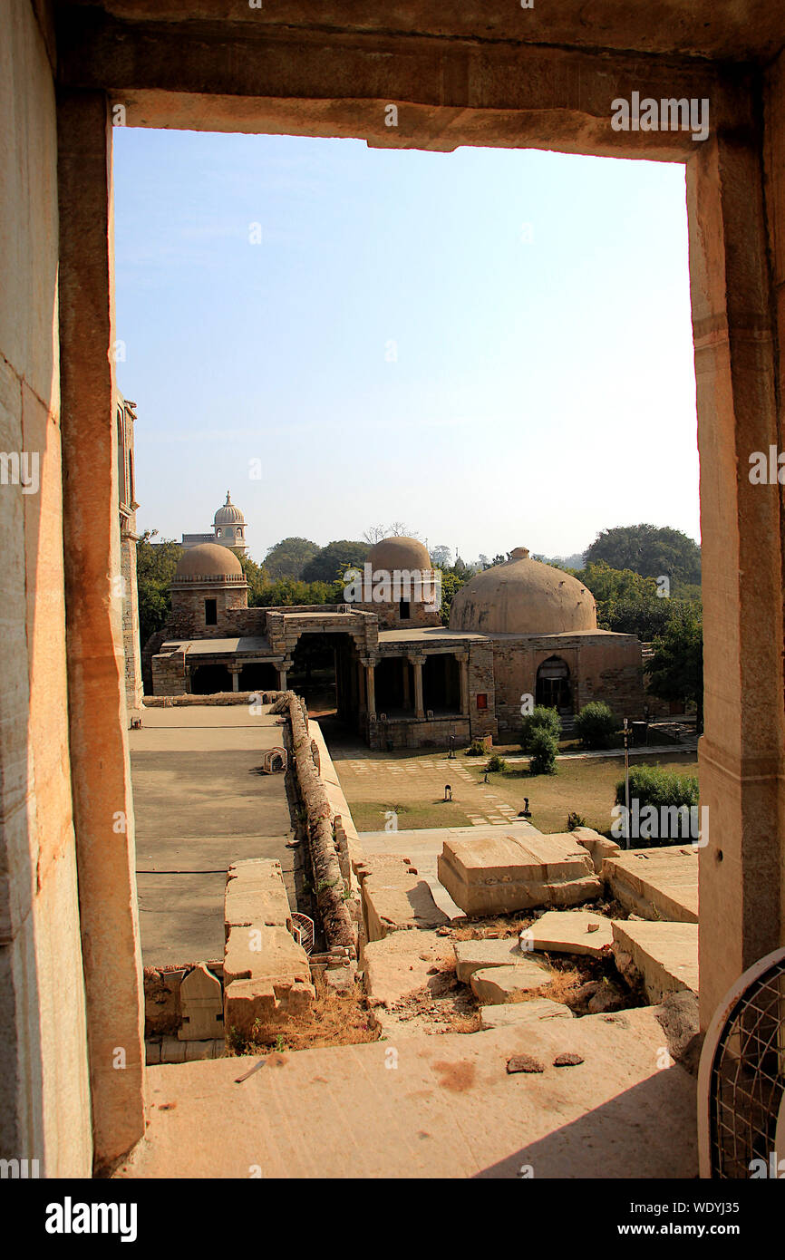 Various buildings of Kumbh Mahal viewed through stone door frame at ...