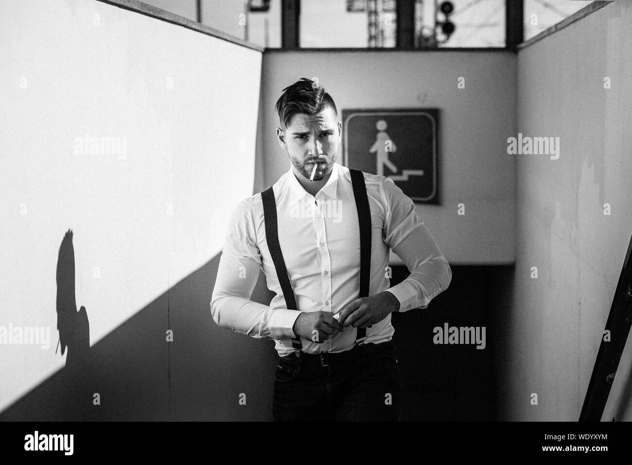 Business person standing on stairs Black and White Stock Photos ...