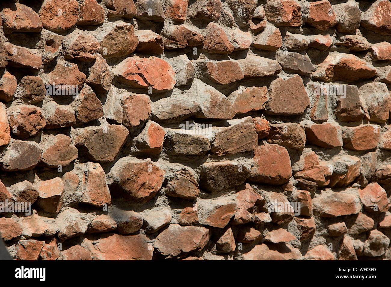 Construction of rubble stone masonry wall with dressed face bonded with ...