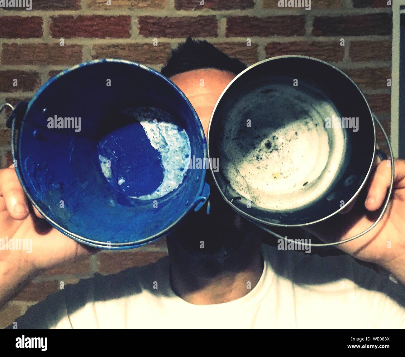 Holding buckets hi-res stock photography and images - Alamy