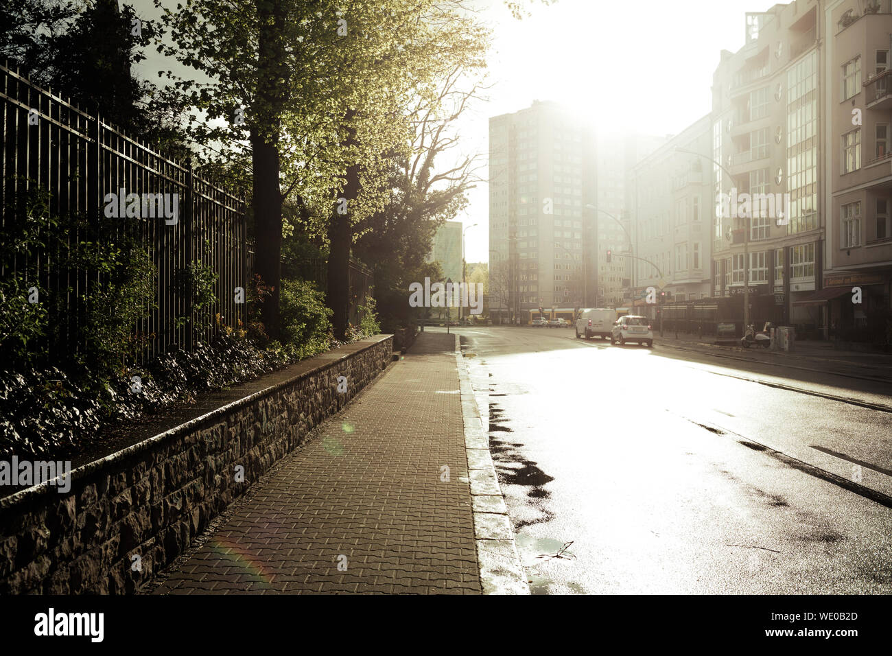 Fence on an empty city street hi-res stock photography and images - Alamy