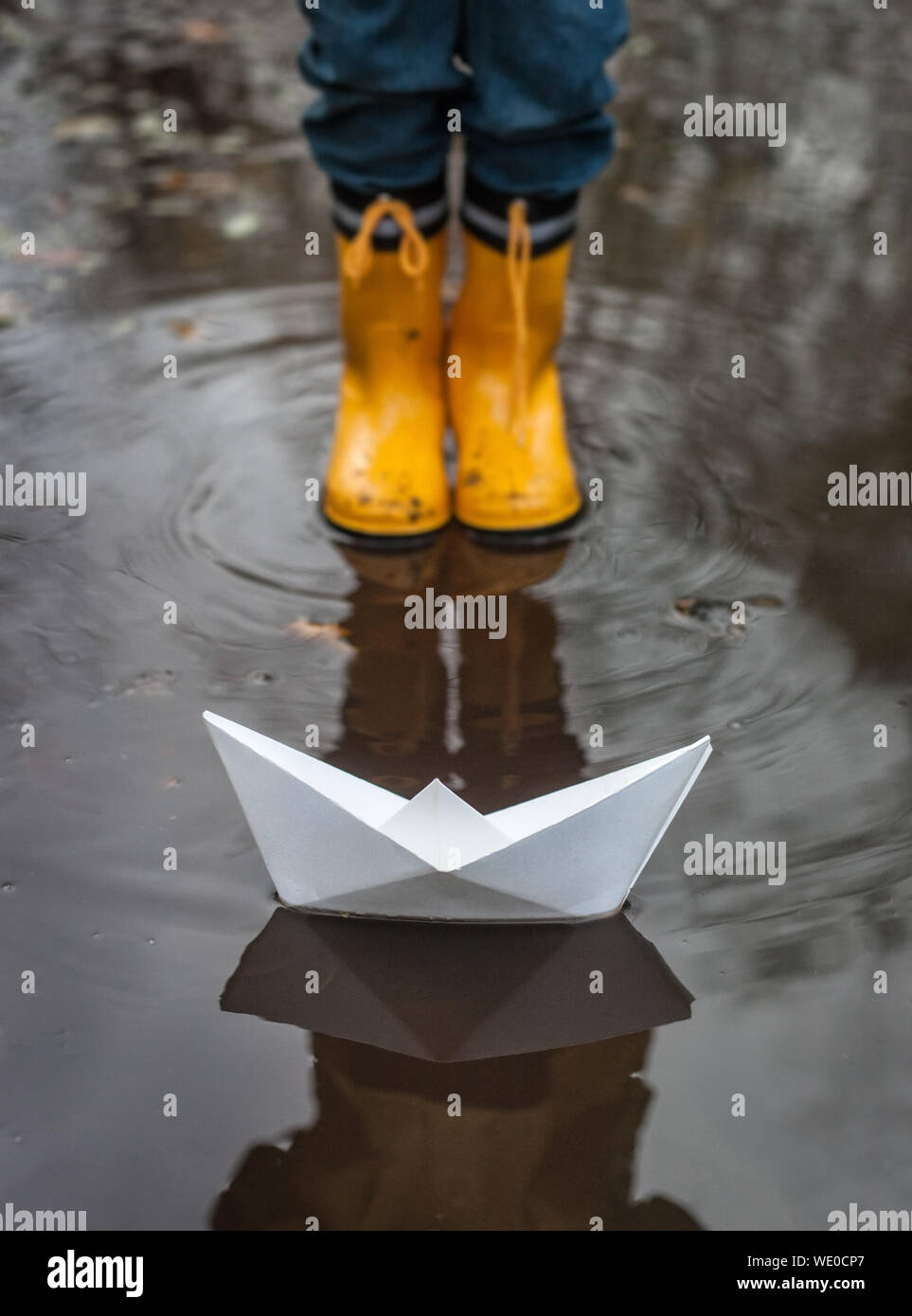 Paper boat puddle hi-res stock photography and images - Alamy