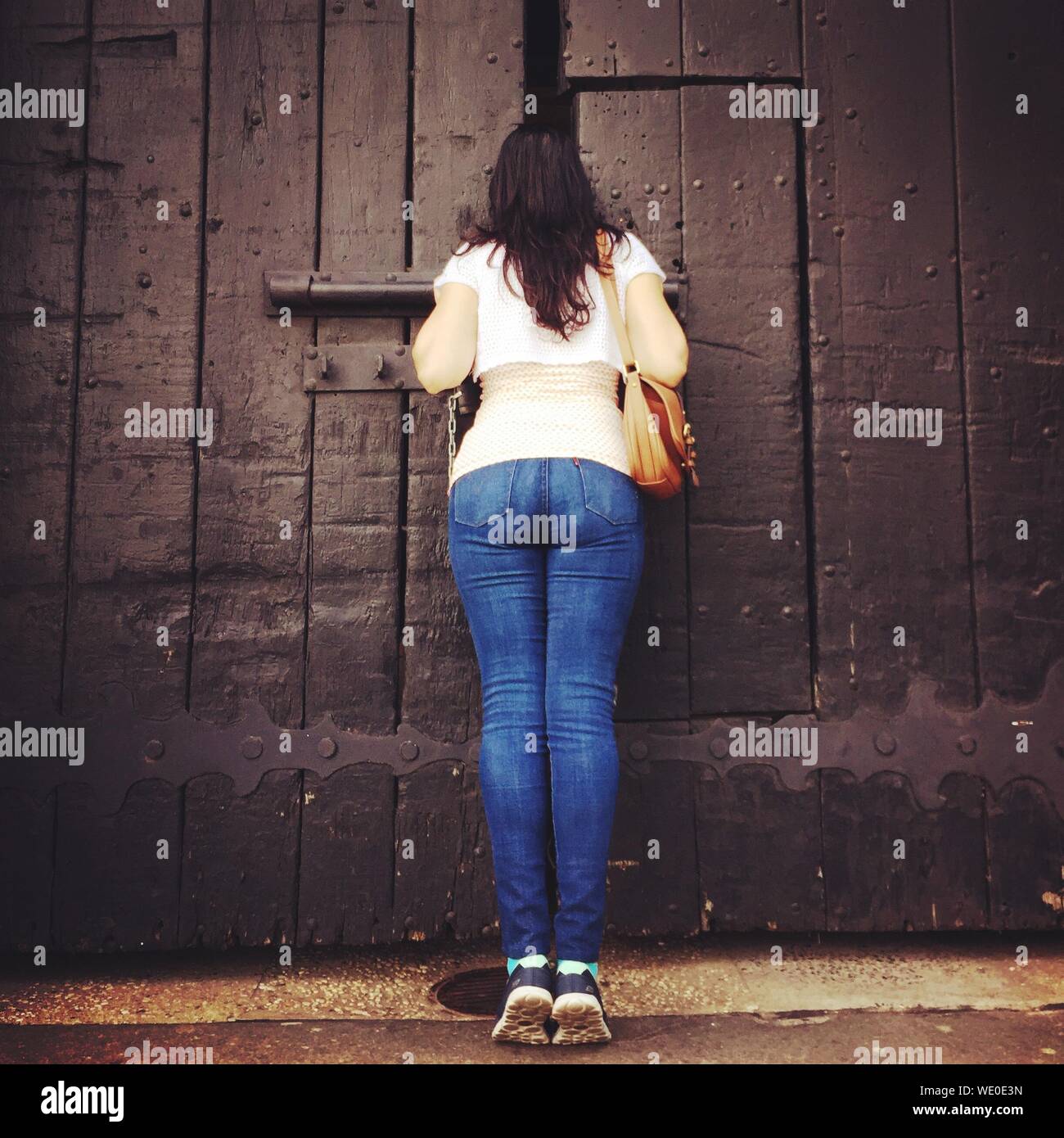 Woman see through door hi-res stock photography and images - Alamy