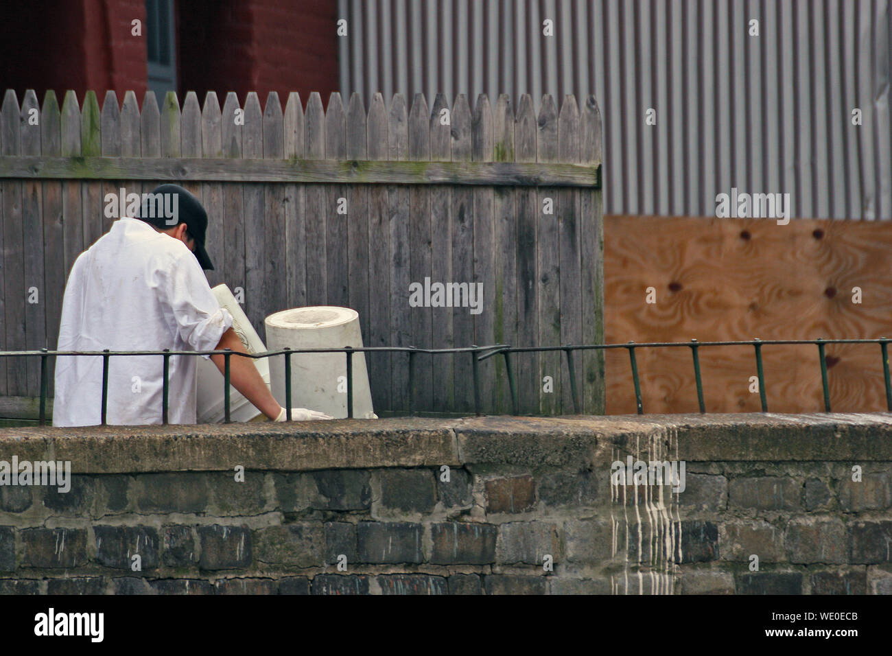 Man with buckets hi-res stock photography and images - Alamy
