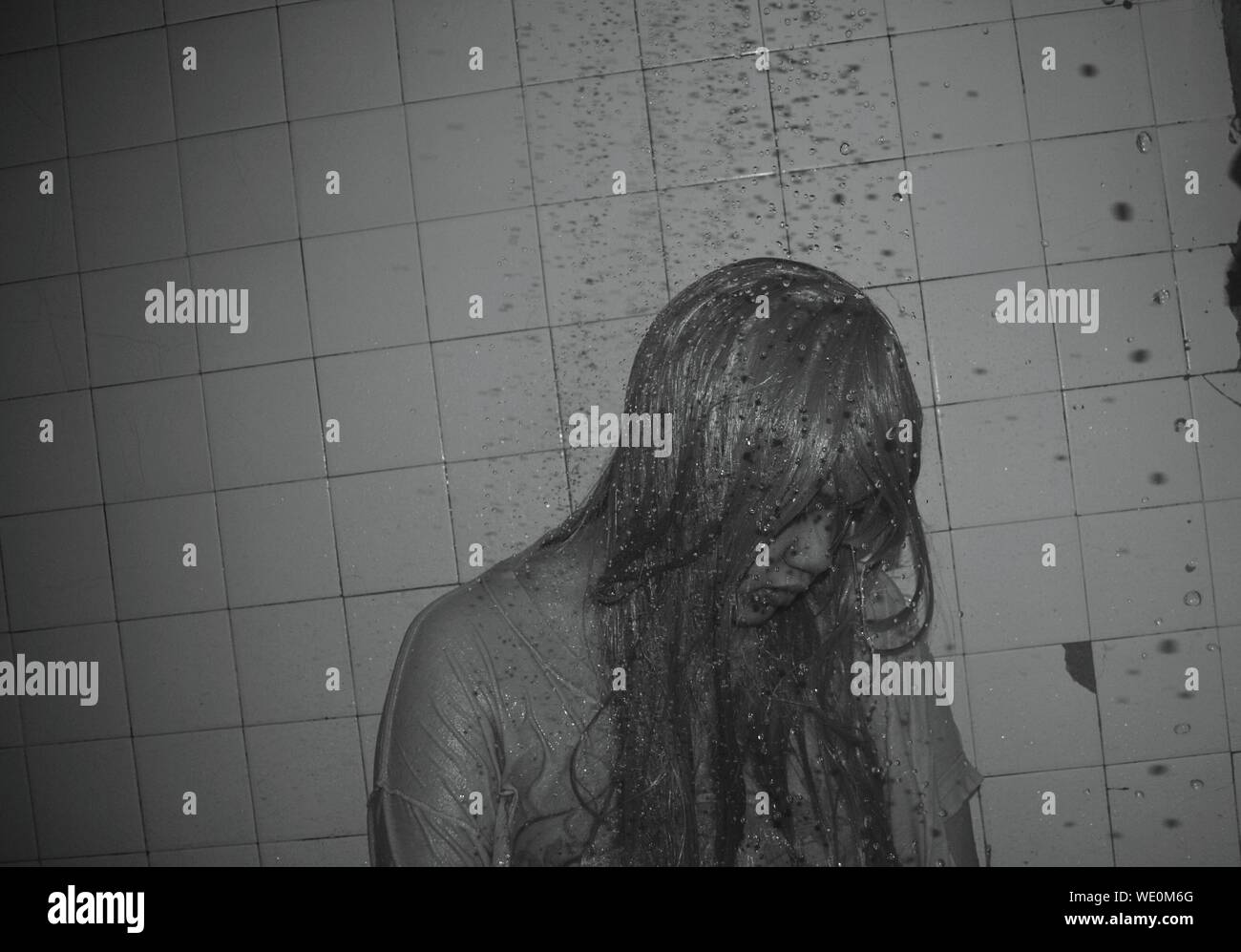 Woman under shower hi-res stock photography and images - Alamy