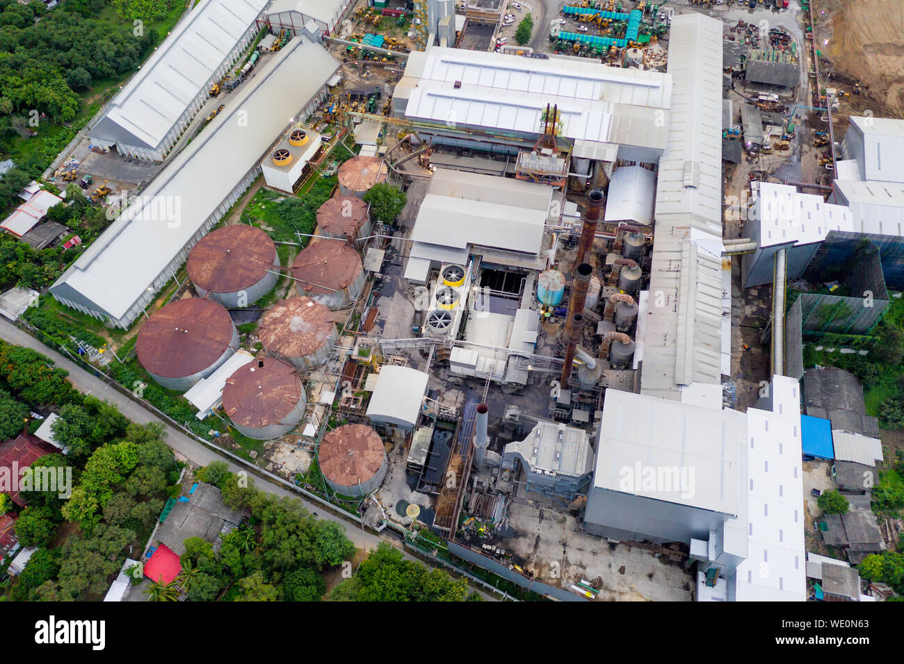 Aerial view, Processing factory of molasses and sugar with emission ...