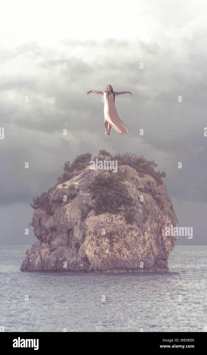 Surreal woman flying hi-res stock photography and images - Alamy